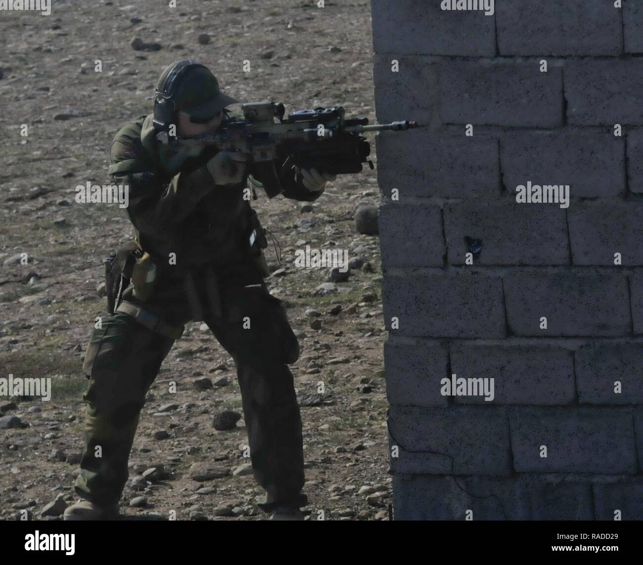 A Norwegian soldier acts as an enemy during urban operations training ...