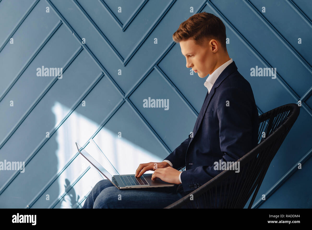 stylish young guy with laptop, young businessman, freelancer work ...