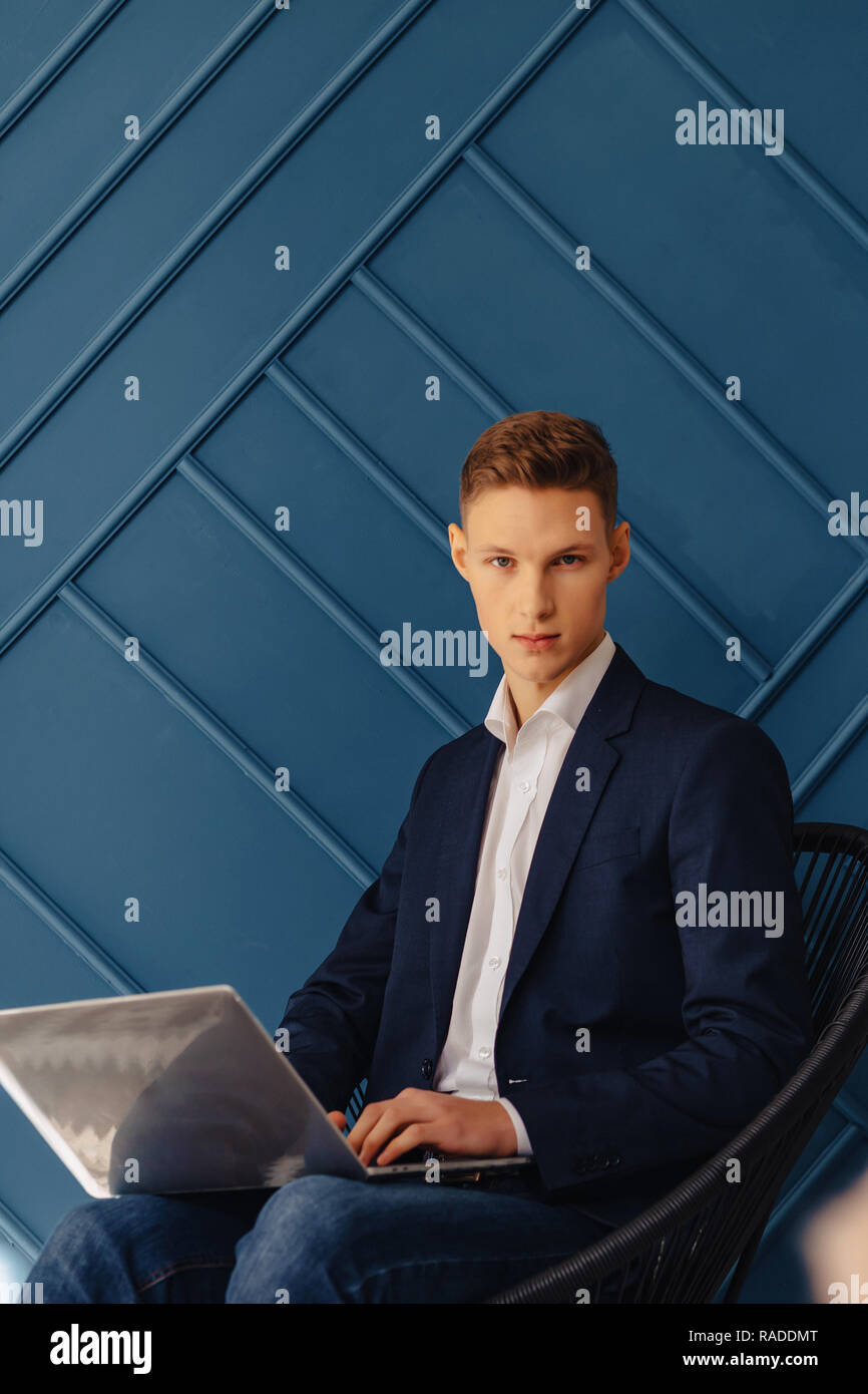 stylish young guy with laptop, young businessman, freelancer work ...