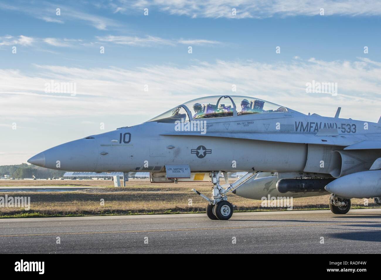 An F-18D Hornet taxis down the flight line for a training exercise ...