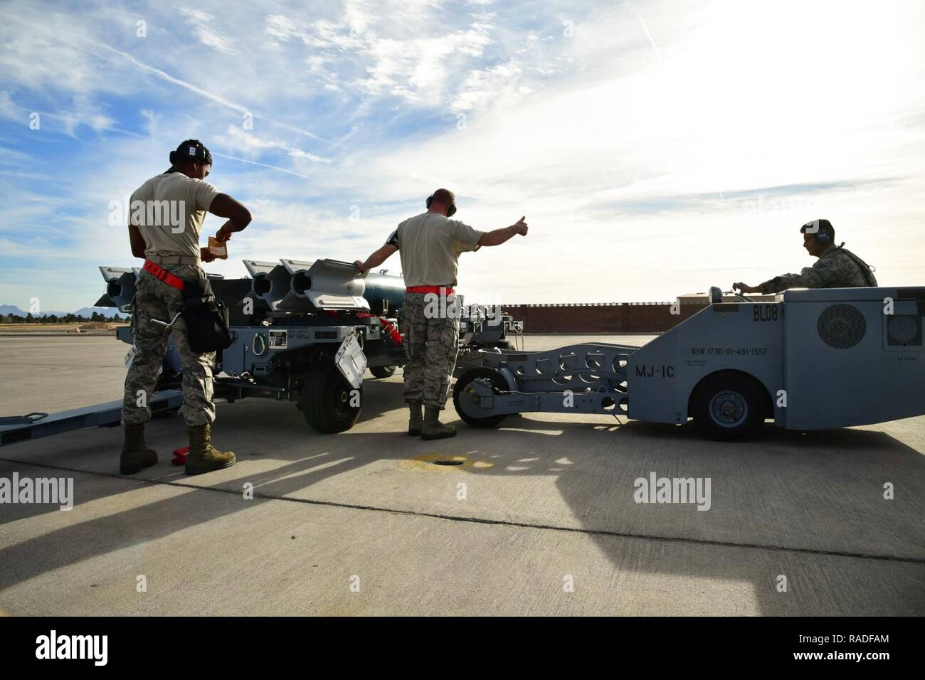 An Air Force weapons load crew assigned to the 34th Aircraft ...