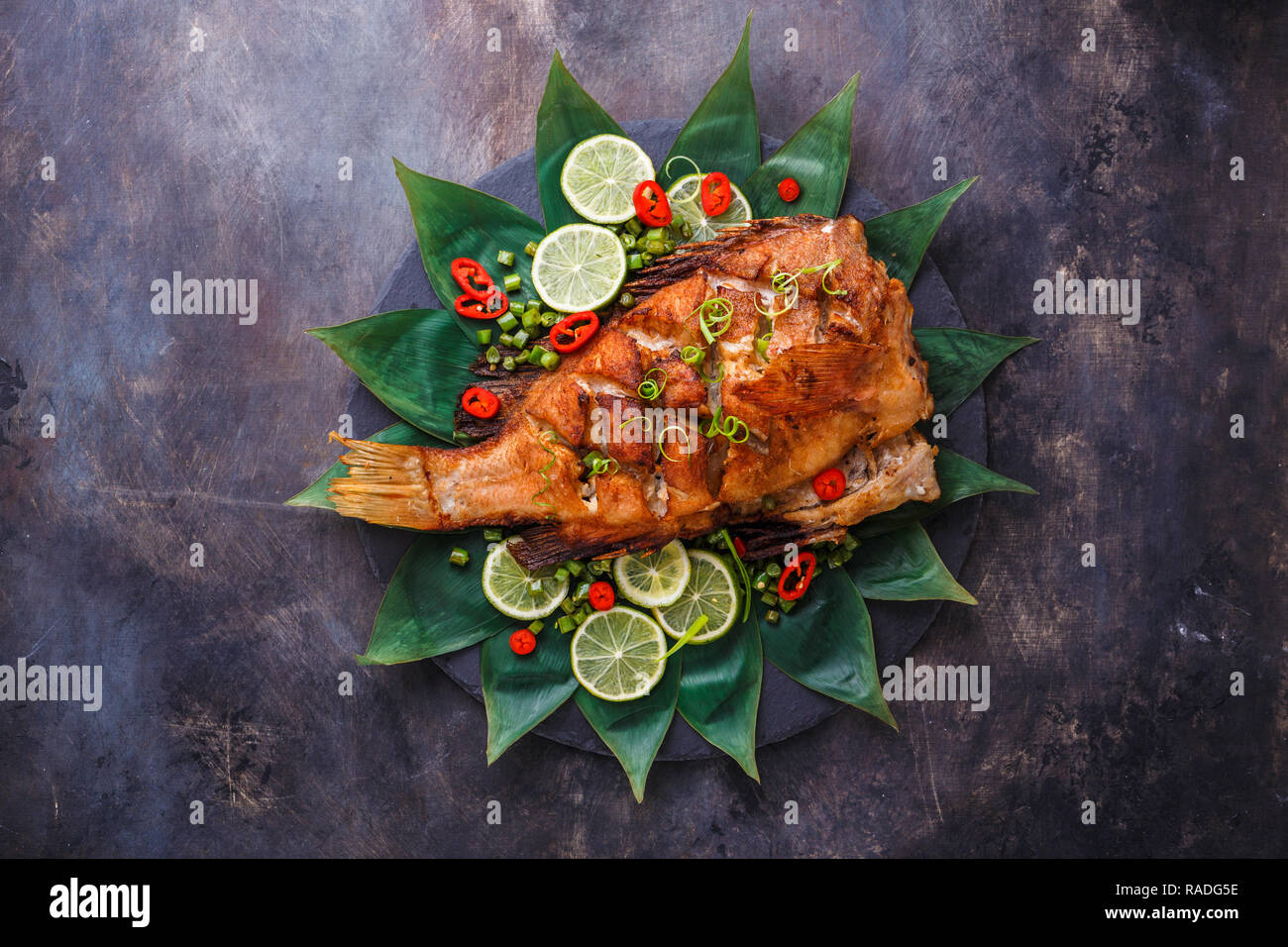 Whole fried fish and rice hi-res stock photography and images - Alamy