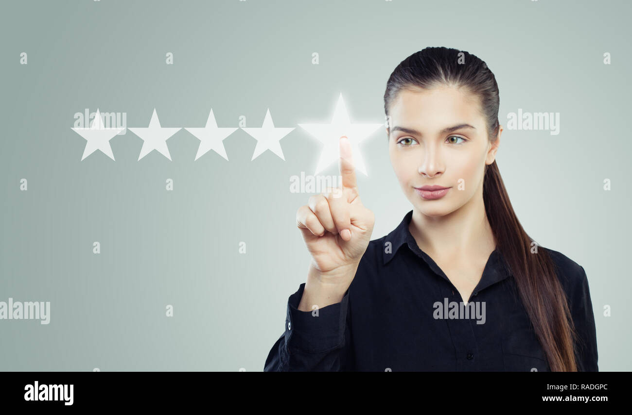 Young woman pointing at stars hi-res stock photography and images - Alamy