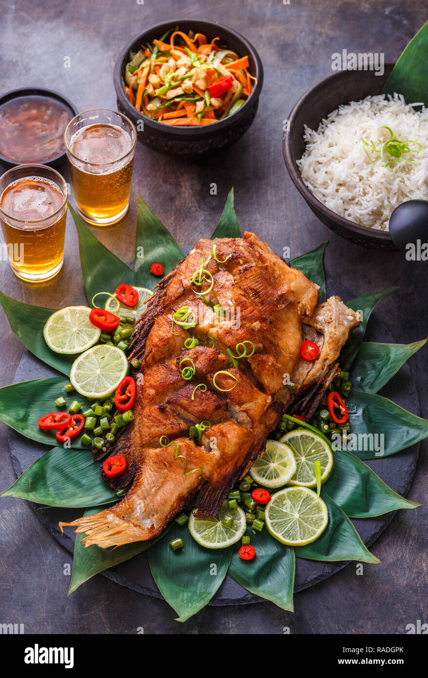 Whole fried fish and rice hi-res stock photography and images - Alamy
