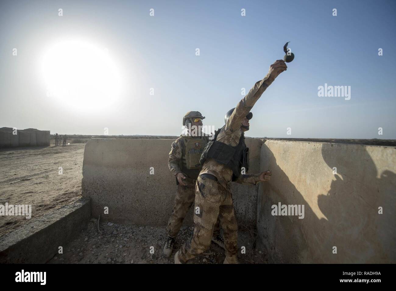 An Iraqi Counter-Terrorism Service trainee throws a live fragmentation ...