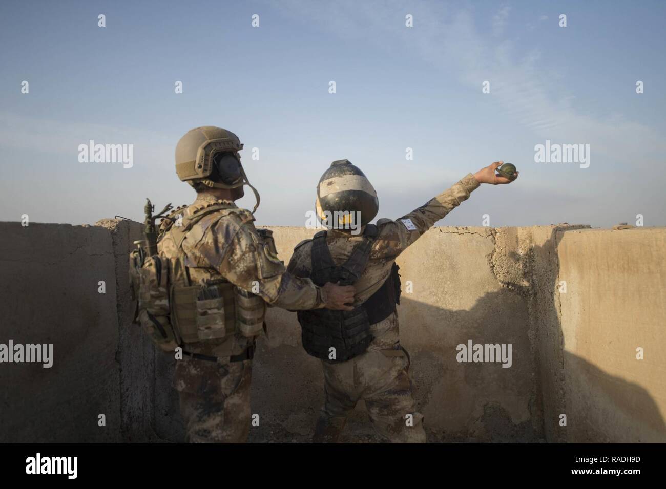 An Iraqi Counter-Terrorism Service trainee throws a live fragmentation ...