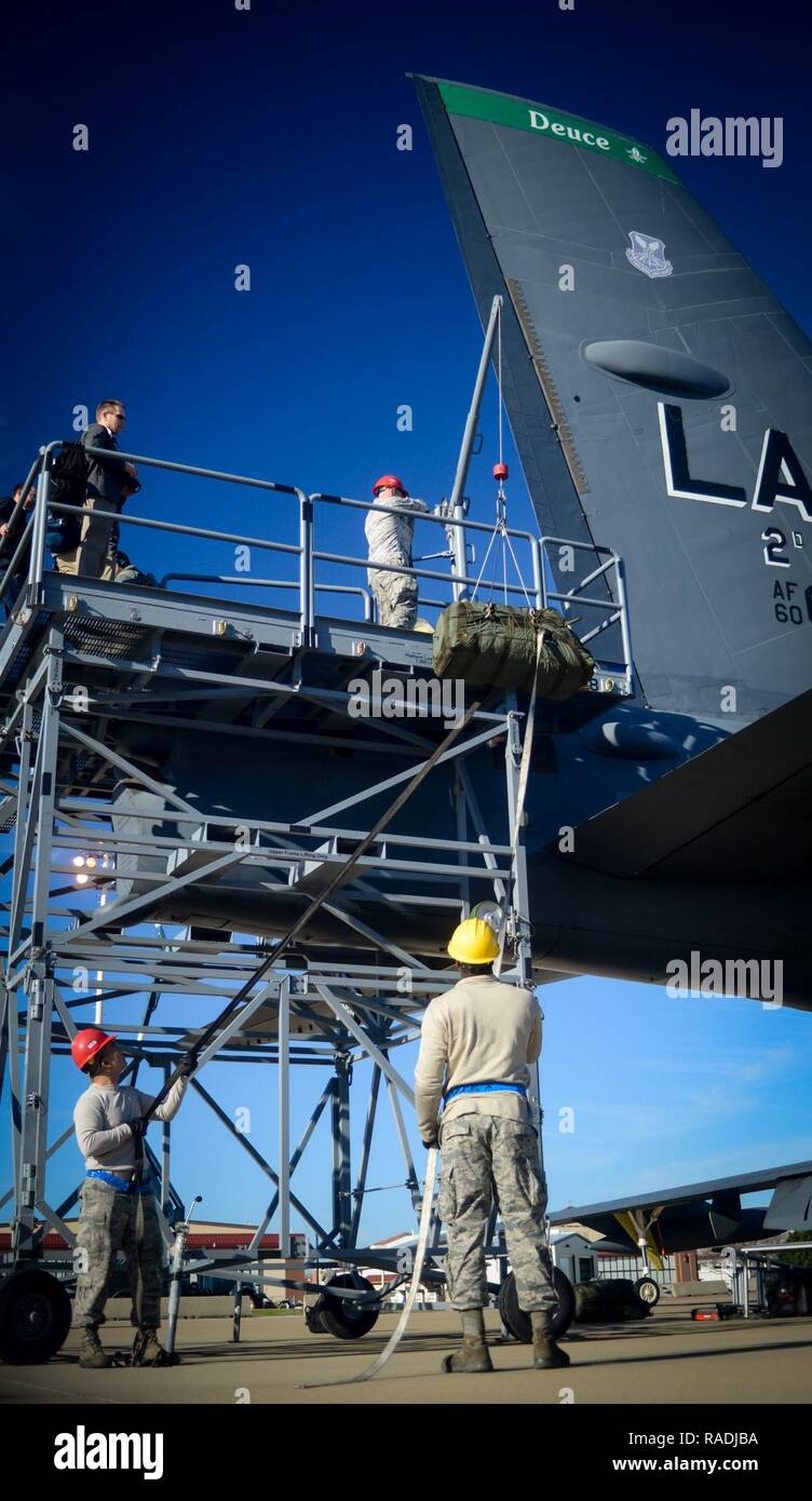 Crew chiefs from the 20th Aircraft Maintenance Unit hoist a packaged ...