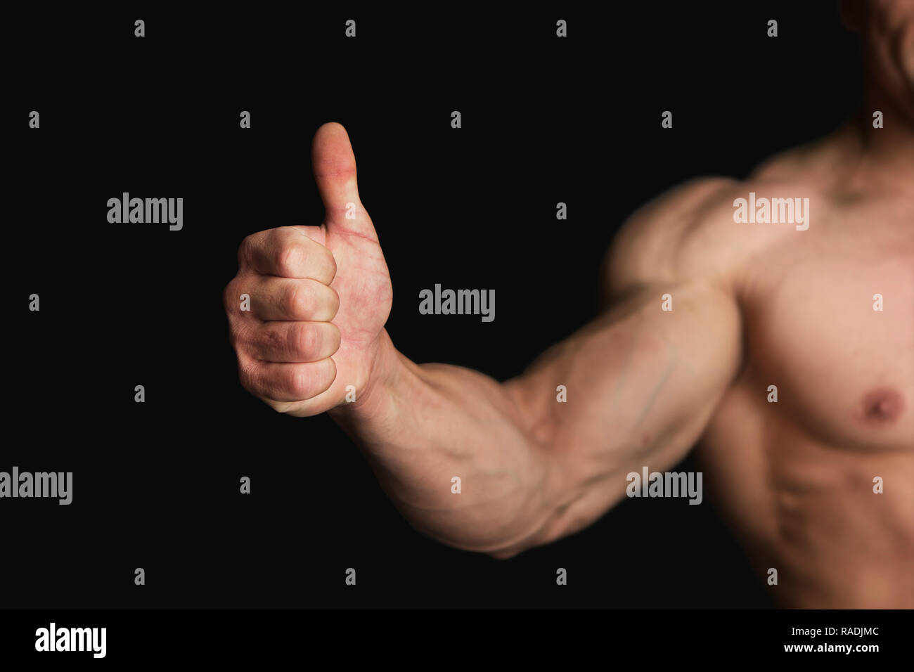 Young black man showing muscles hi-res stock photography and images - Alamy