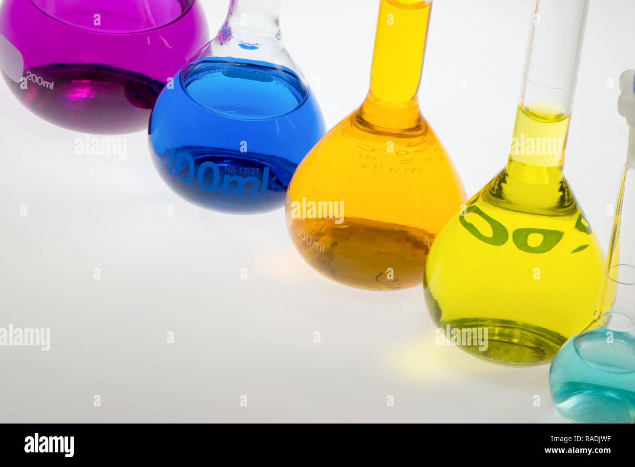 chemical flasks in diagonal line filled with colored solutions Stock ...
