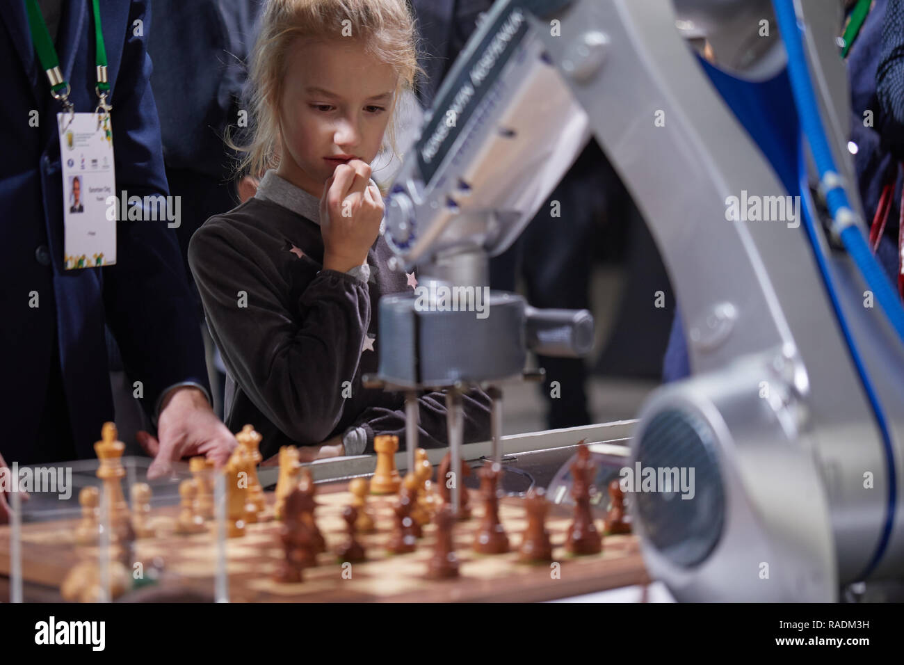 St. Petersburg, Russia - December 27, 2018: Robot playing chess with a ...