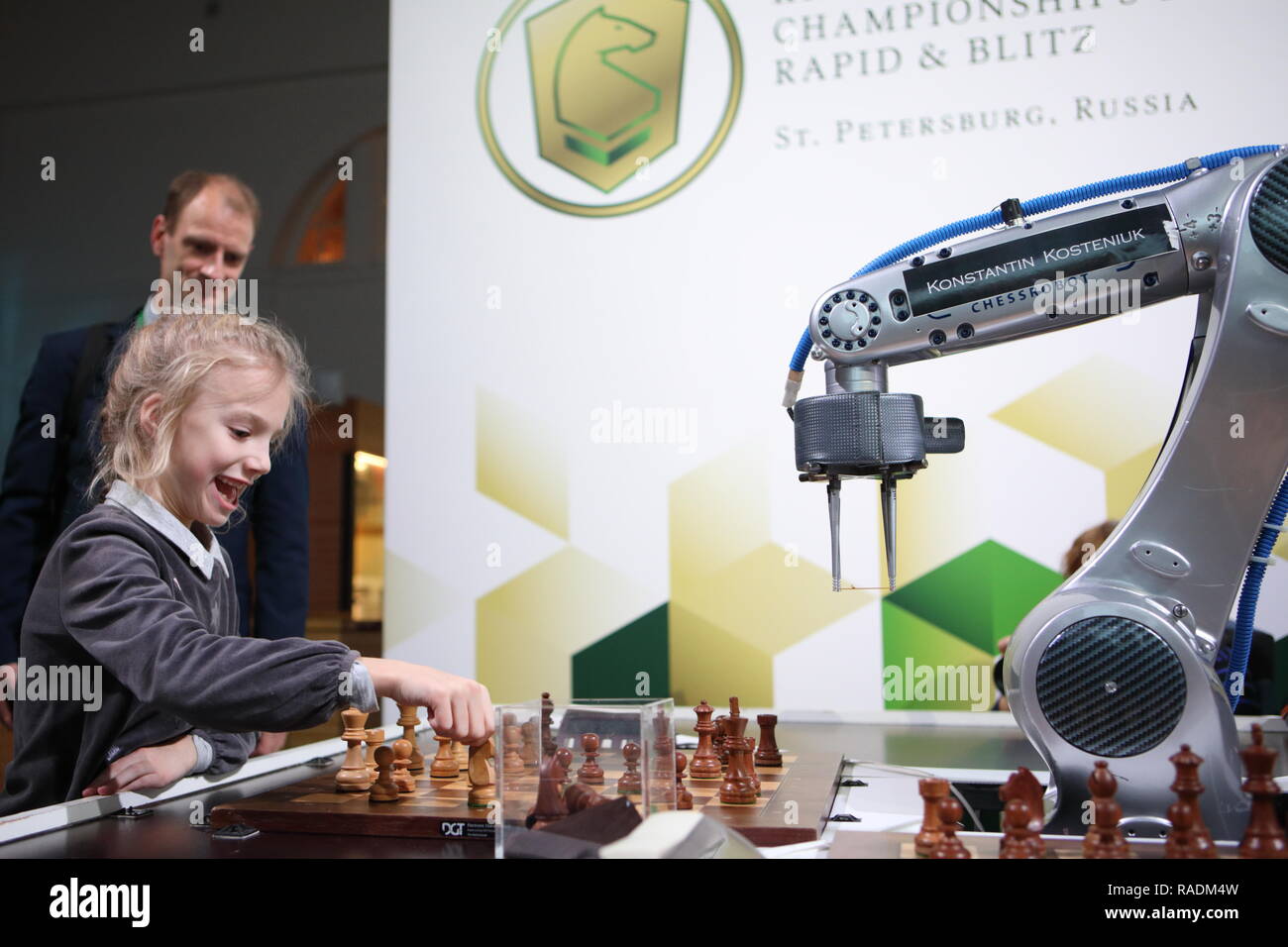 St. Petersburg, Russia - December 27, 2018: Robot playing chess with a ...