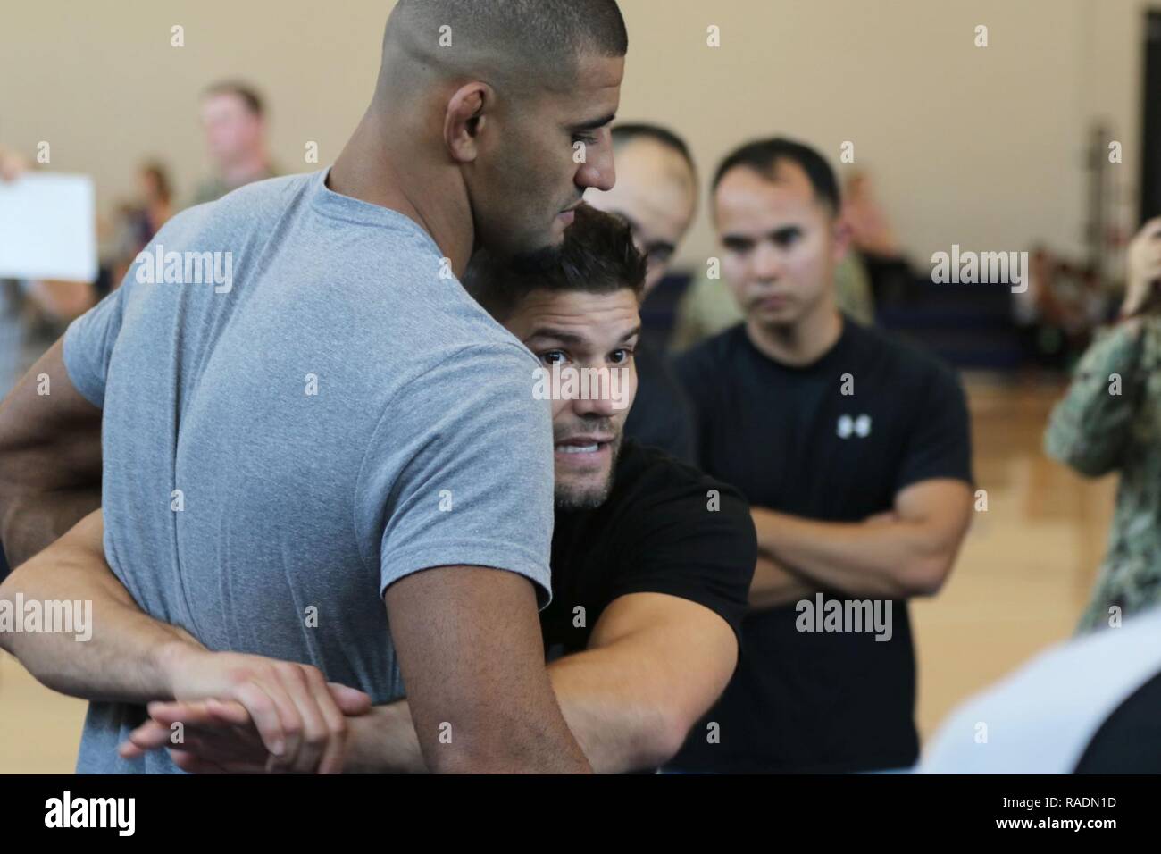 Bellator MMA fighter Josh Thomson demonstrates a fighting technique ...