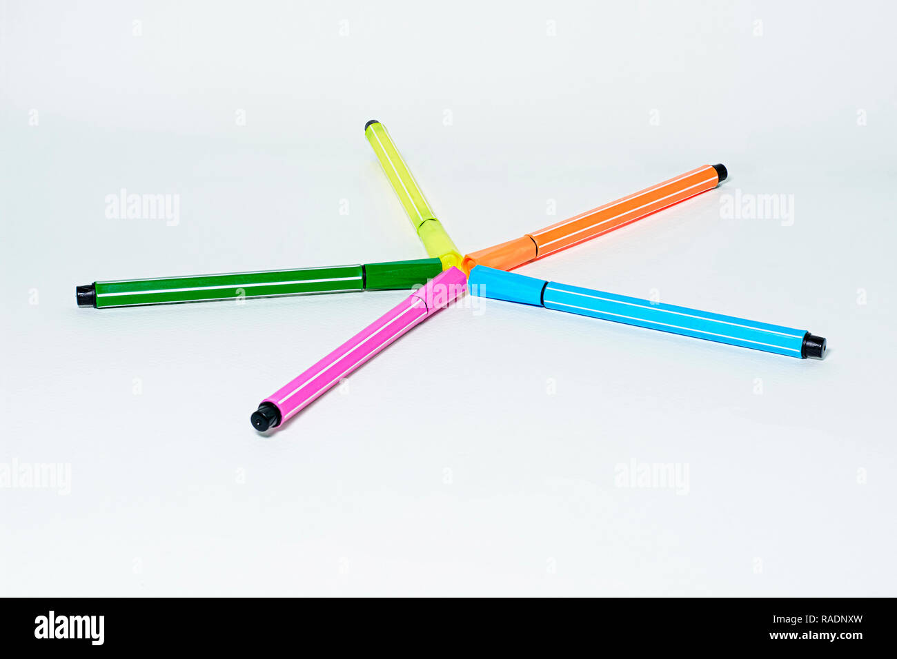 The multi colored magic pen on a white background Stock Photo - Alamy
