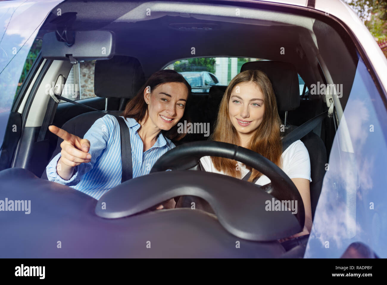 Teenage girl learning to drive with her mother Stock Photo - Alamy