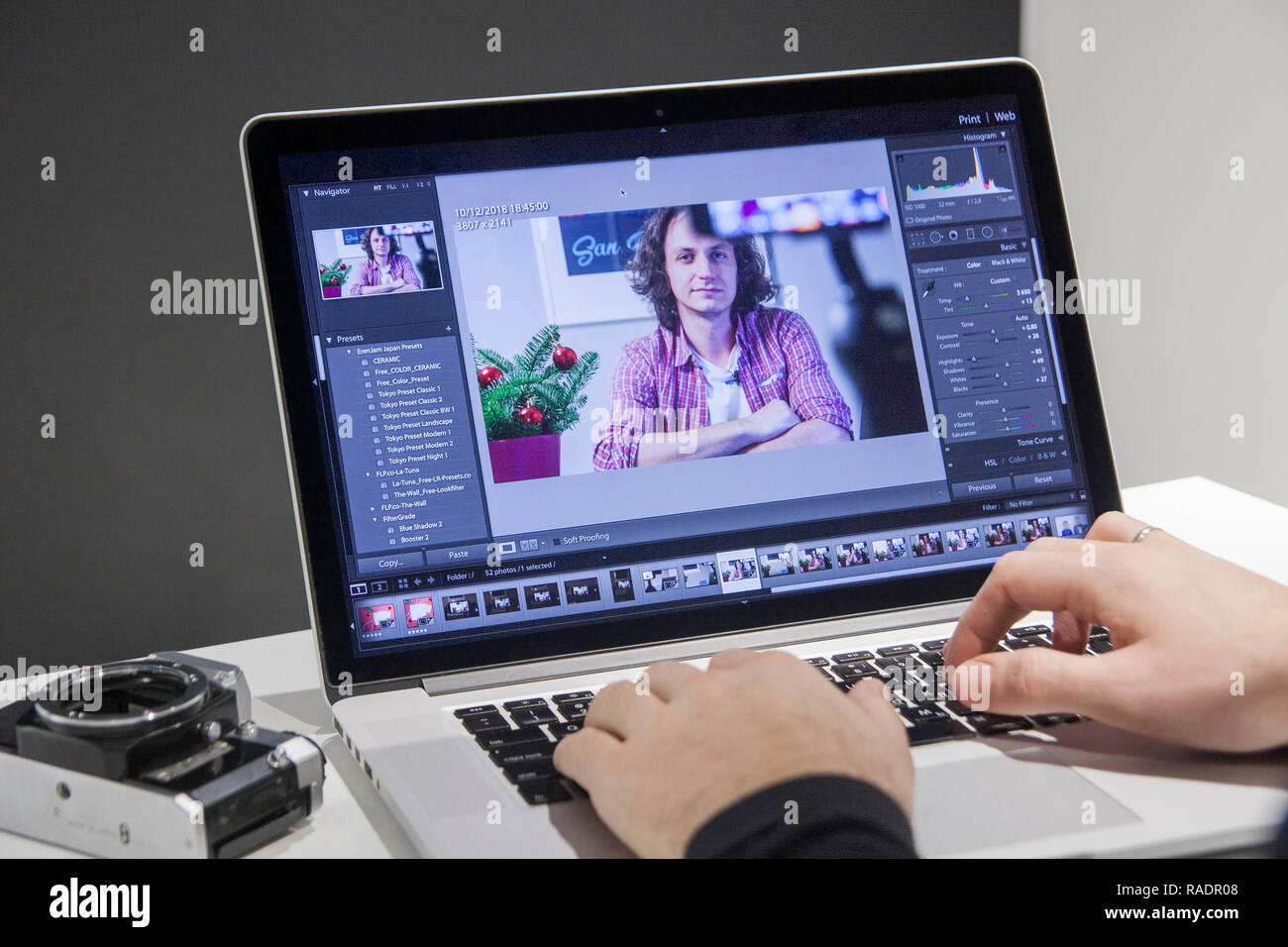 Professional photo editor working on laptop in special colorgrade ...