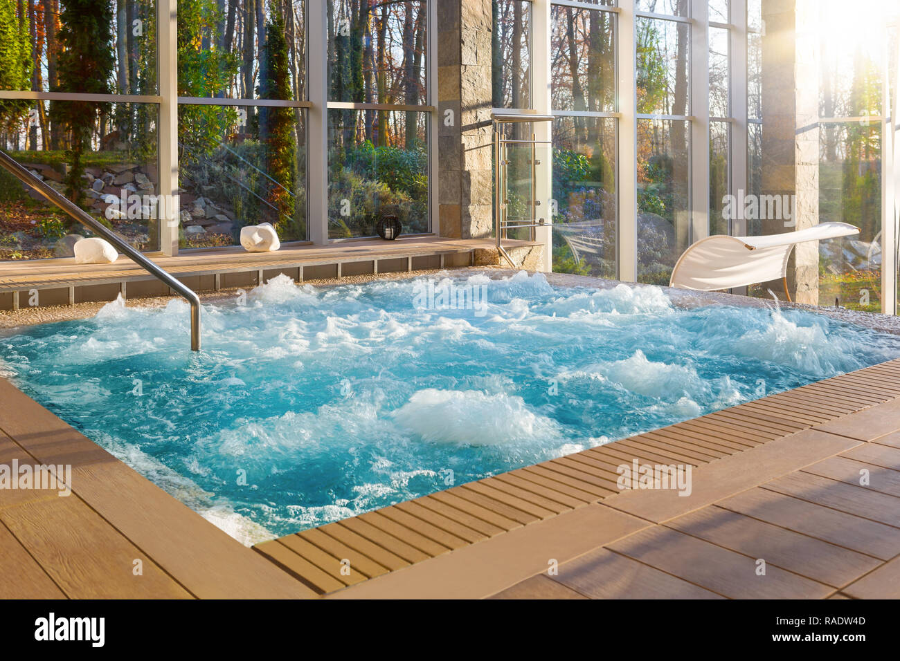 Luxurious hot tub spa in boutique hotel with big glass windows with ...