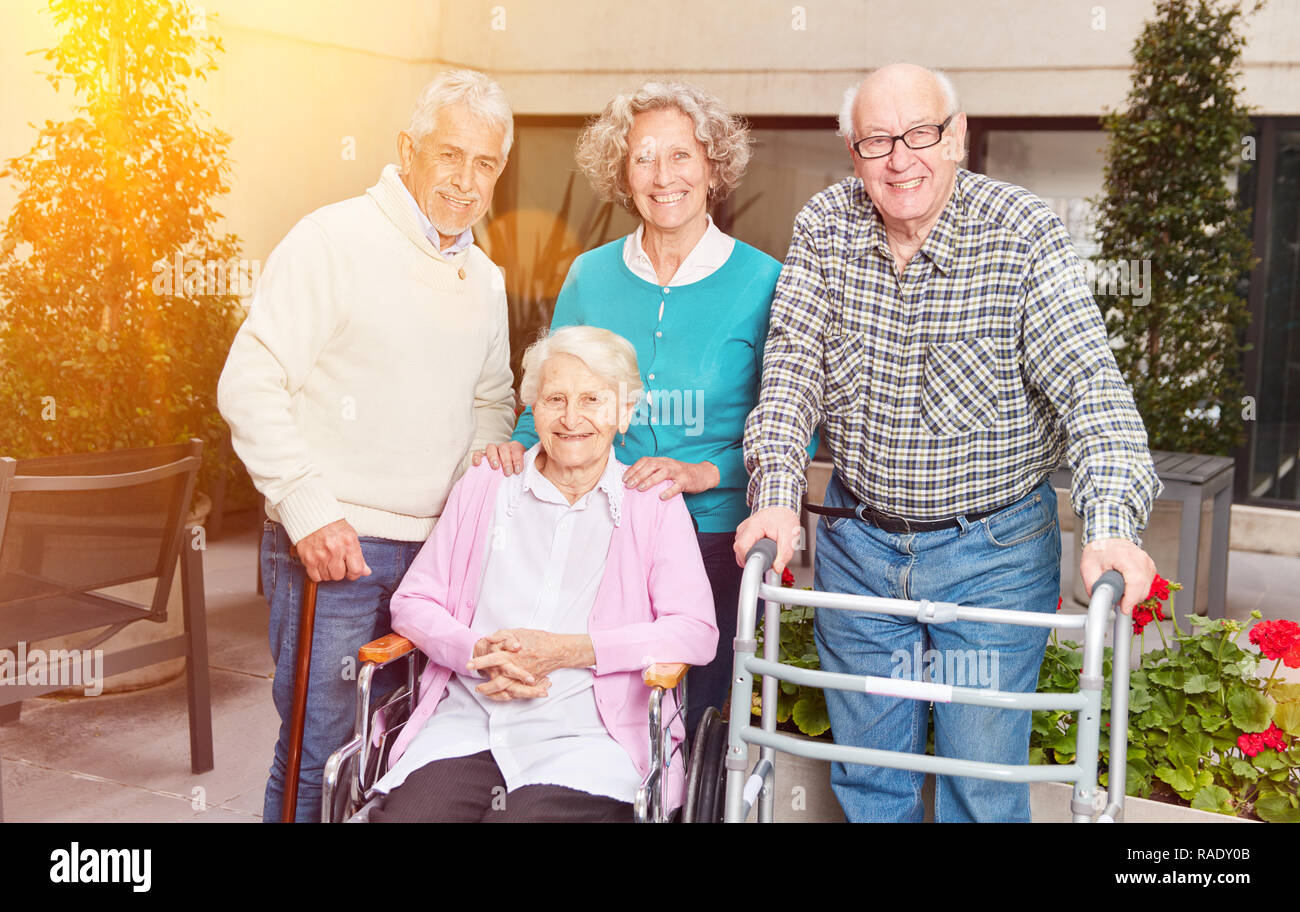 Happy group of seniors together on the terrace of a retirement home ...