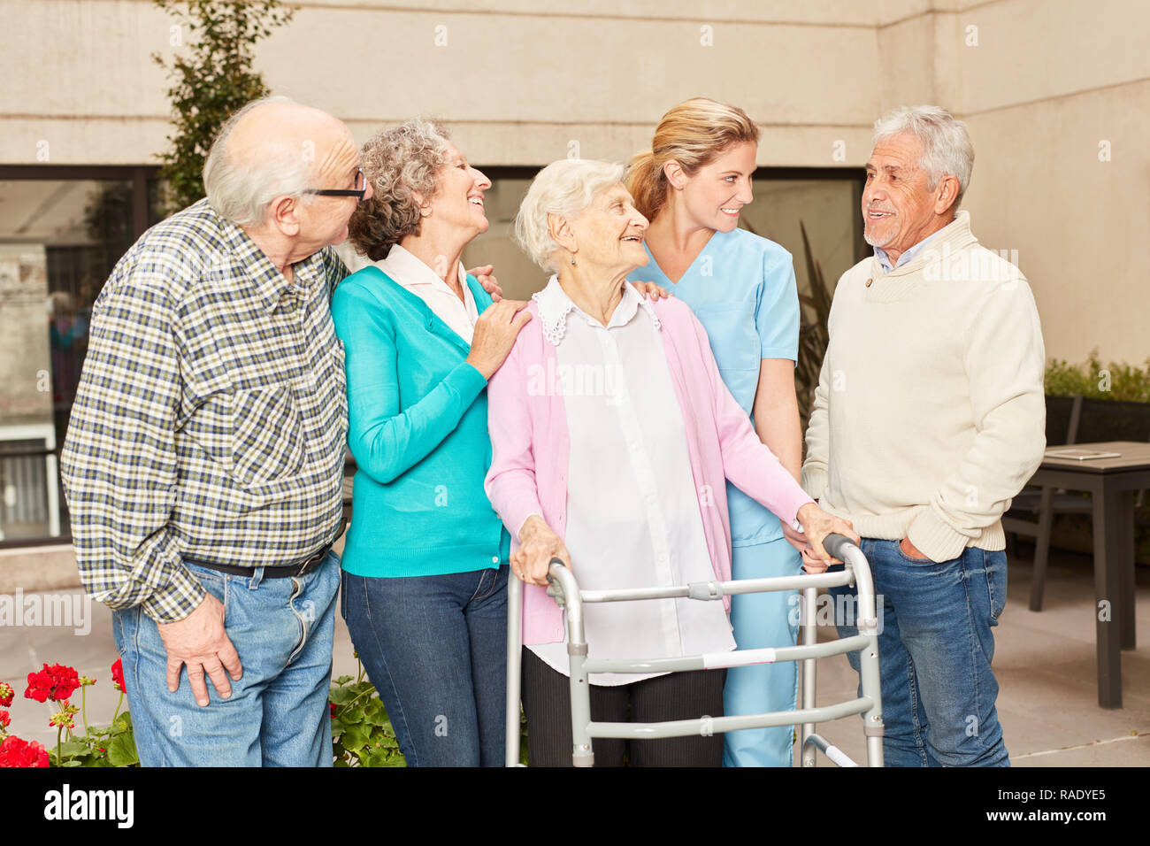Senior group and nurse talking in retirement home or rehab clinic Stock ...