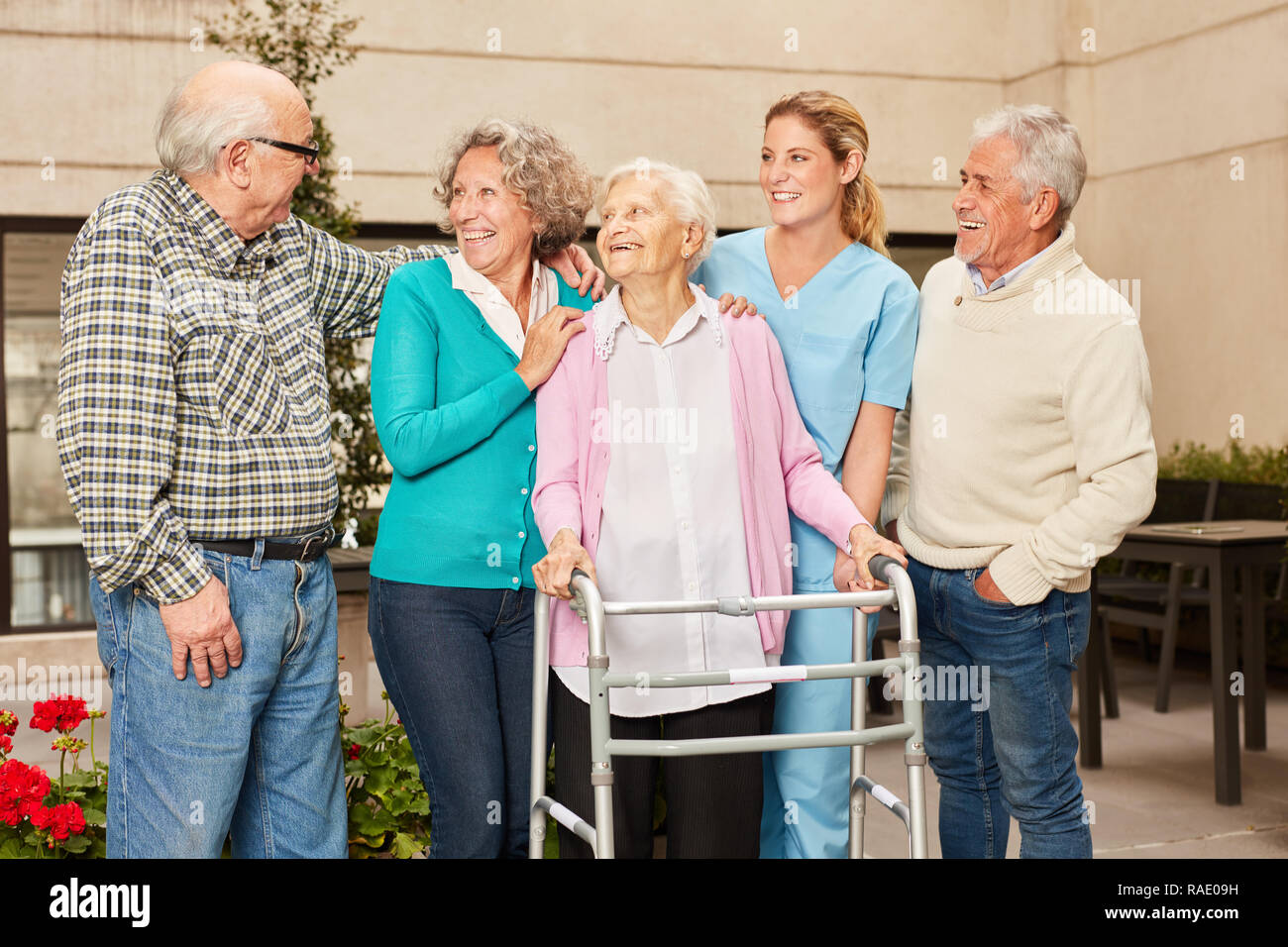 Seniors have fun together in a retirement home or nursing home Stock ...