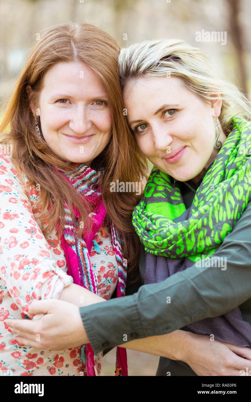 two smiling girlfriend portrait outdoors Stock Photo - Alamy