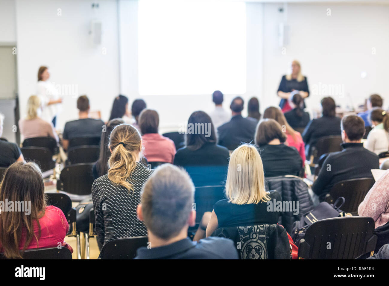 Woman giving presentation on business conference workshop Stock Photo ...