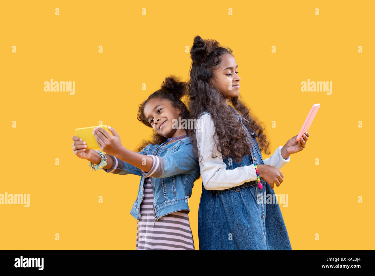 Positive nice girl taking a photo of herself Stock Photo - Alamy