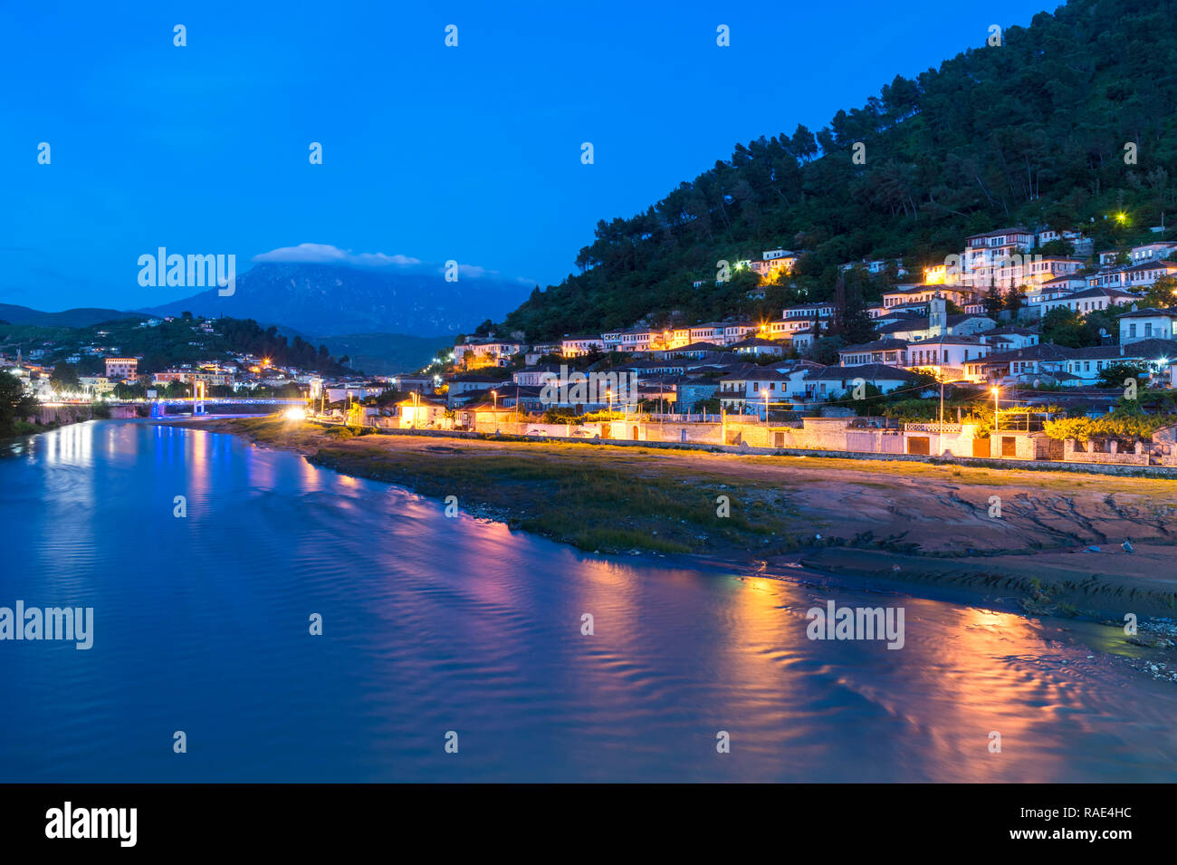 Ottoman houses built on the hills overlooking Berat City at sunset ...