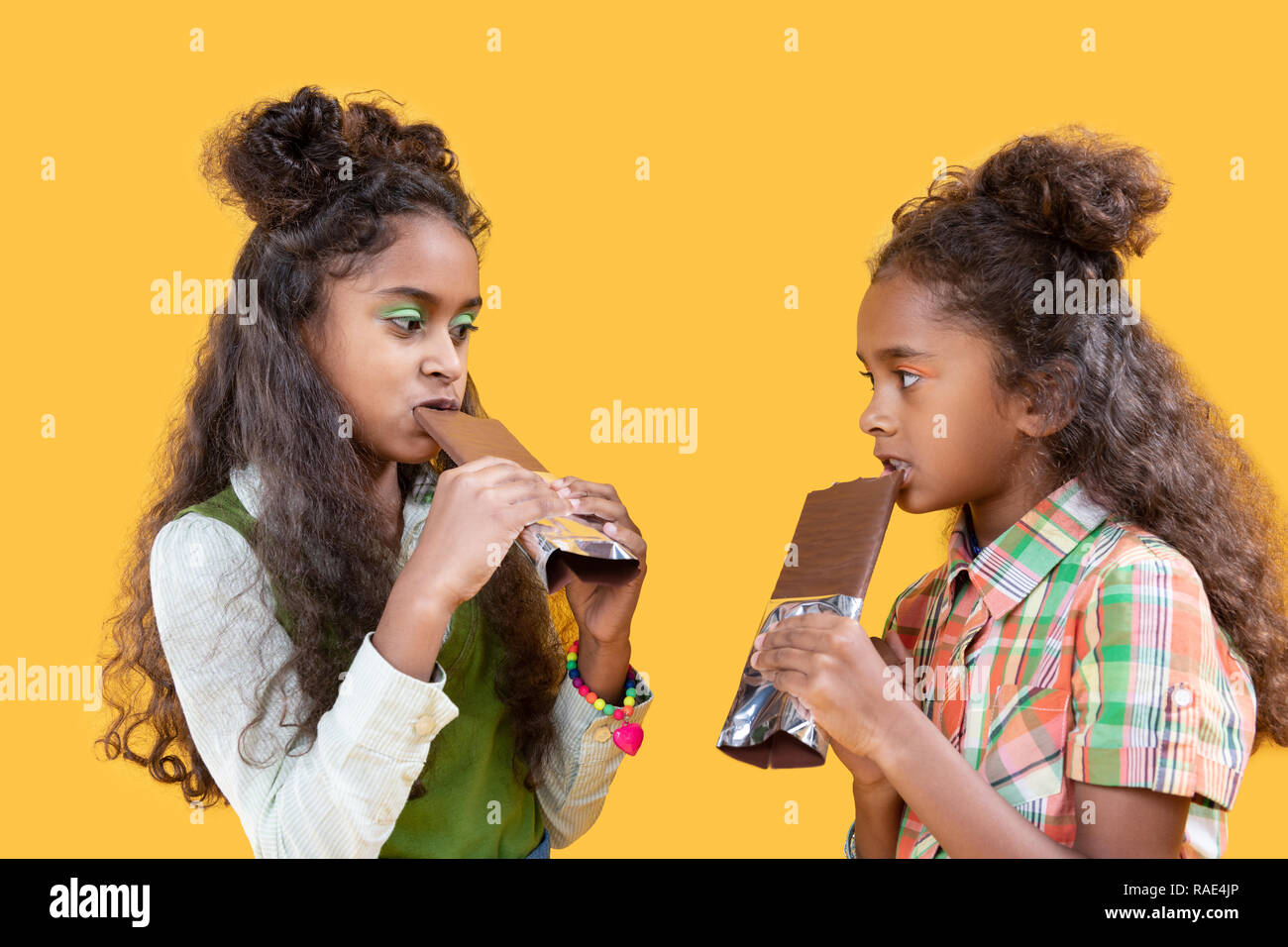 Nice pleasant girls looking at each other Stock Photo - Alamy