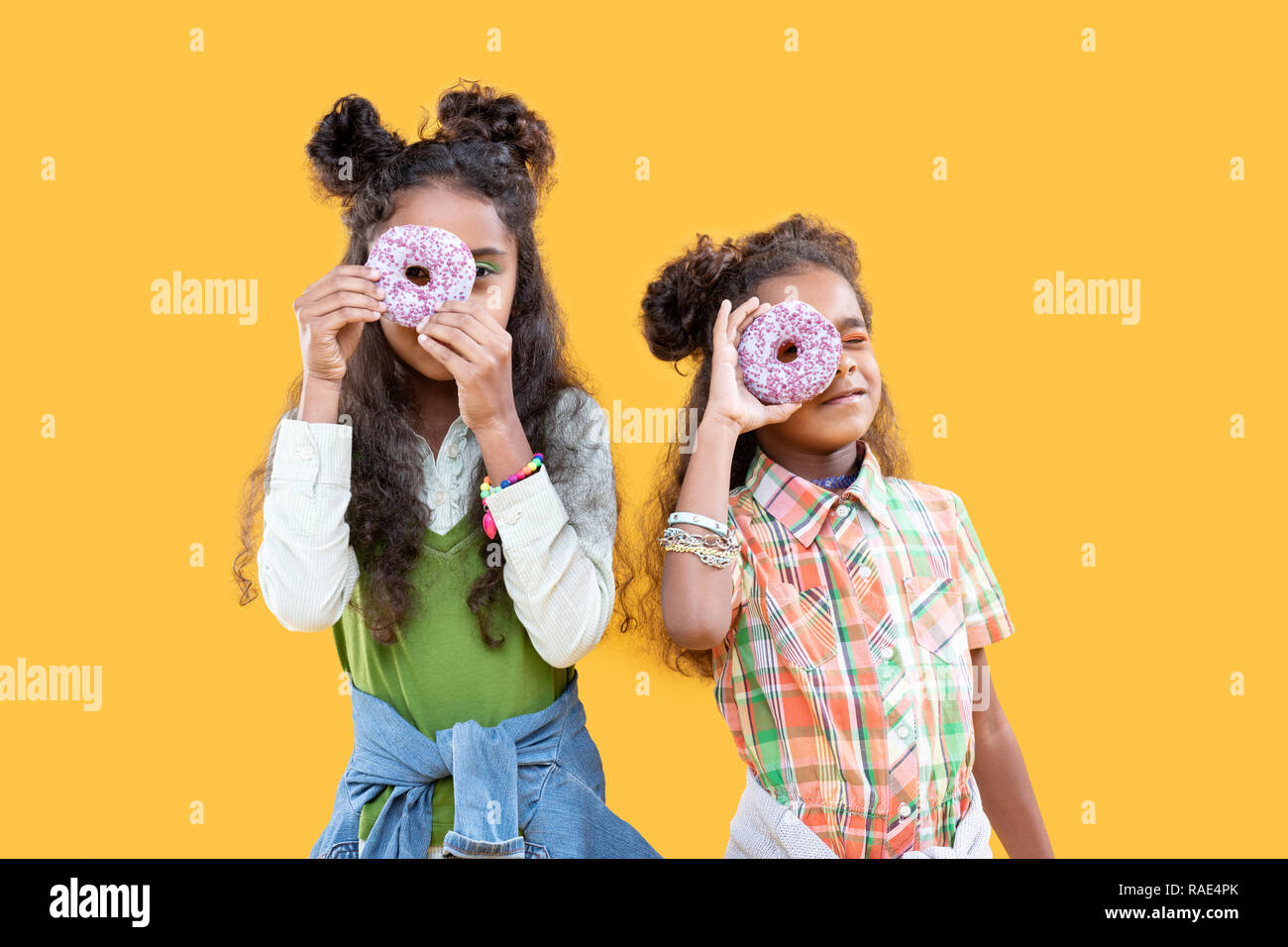Cute afro American girls looking at you Stock Photo - Alamy
