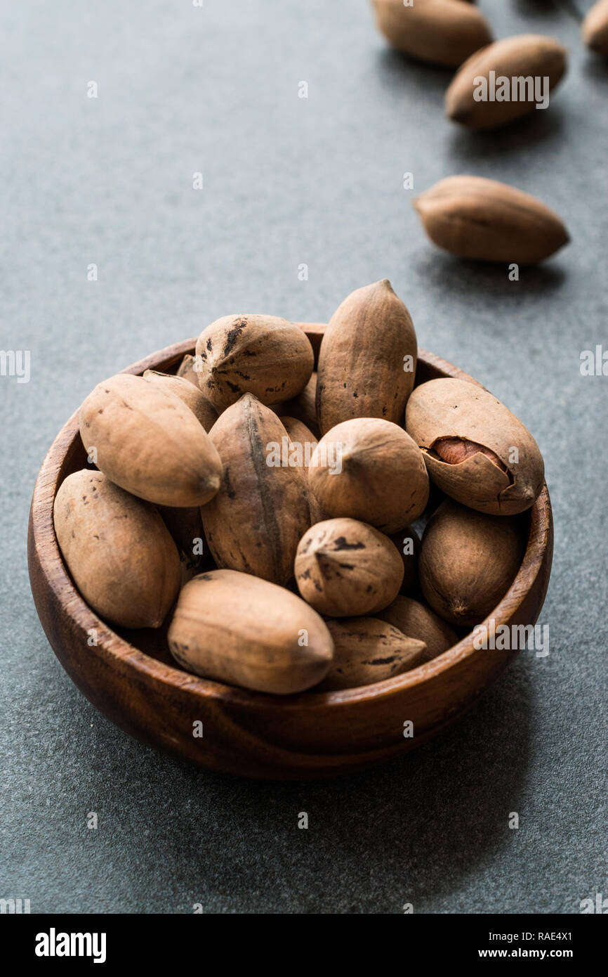 Pecan Nuts with Shell in Wooden Bowl / Walnuts. Organic Food Stock ...
