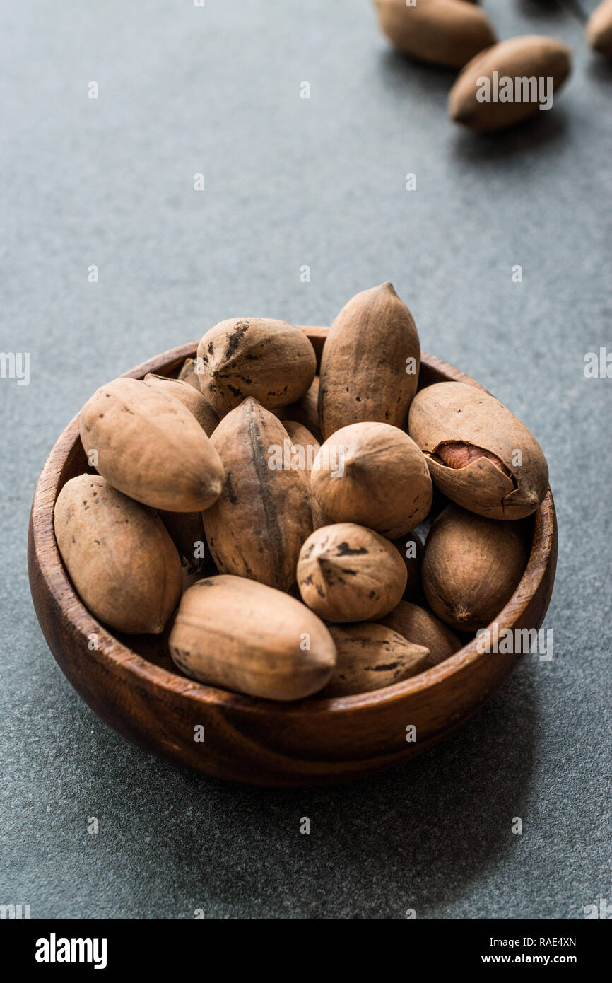 Pecan Nuts with Shell in Wooden Bowl / Walnuts. Organic Food Stock ...