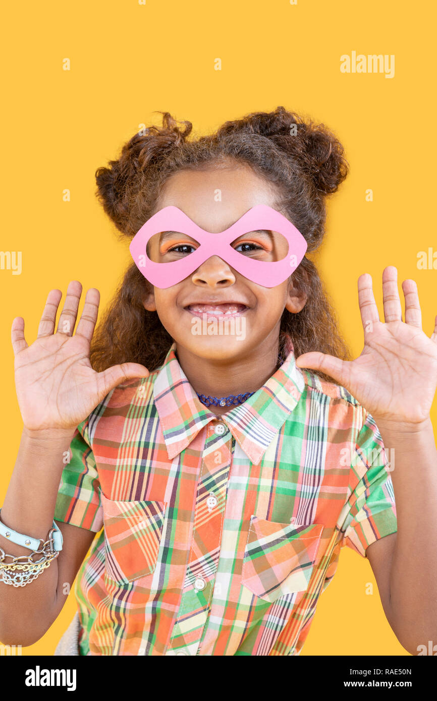 Positive sweet girl showing her hands to you Stock Photo - Alamy