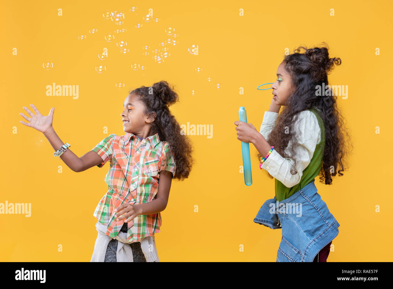 Cheerful child blowing bubbles hi-res stock photography and images - Alamy