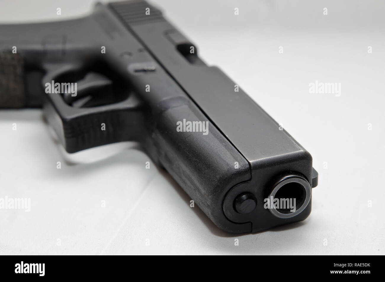 A black semi automatic 40 caliber pistol on a white background Stock ...