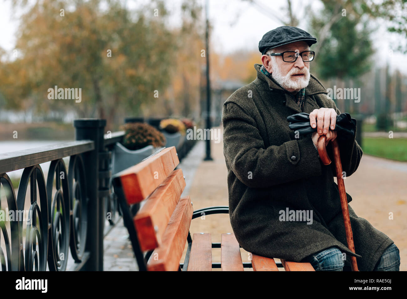 Thoughtful bearded man waiting his senior wife Stock Photo - Alamy