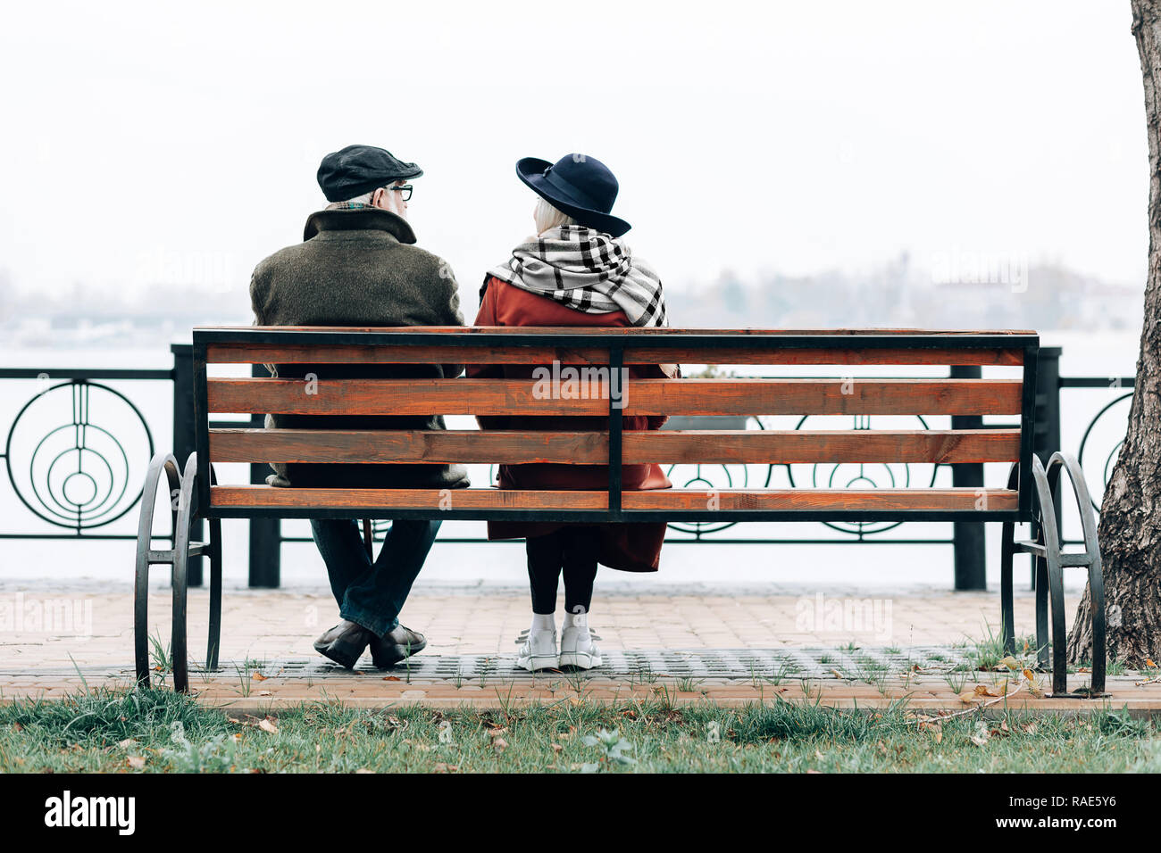 Serious male person sitting with back to camera Stock Photo - Alamy