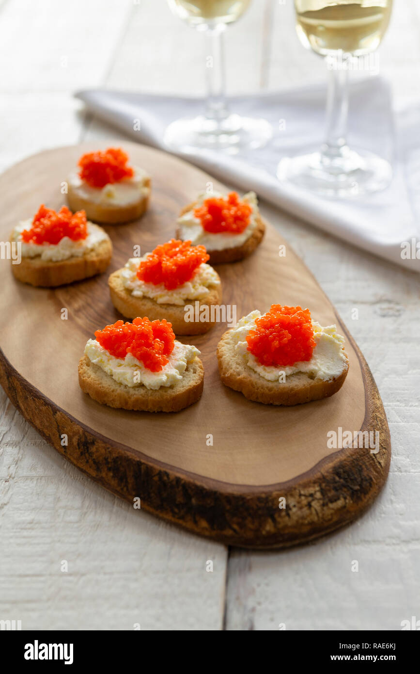 Canapes - crostini with labneh and seaweed pearls Stock Photo - Alamy