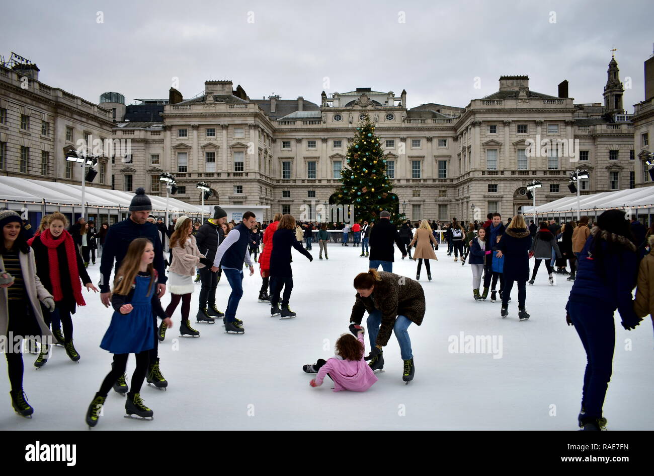 Skating on the ice rink at somerset house hi-res stock photography and ...