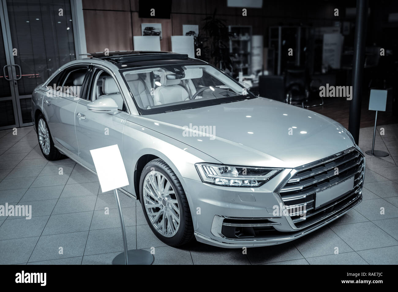 Nice silver car standing in light spacious salon of car dealers Stock ...