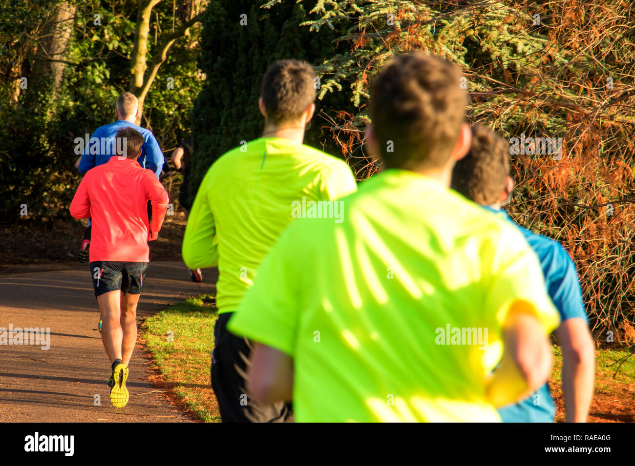 Runners taking part in a parkrun at Bedford Park. This event takes ...
