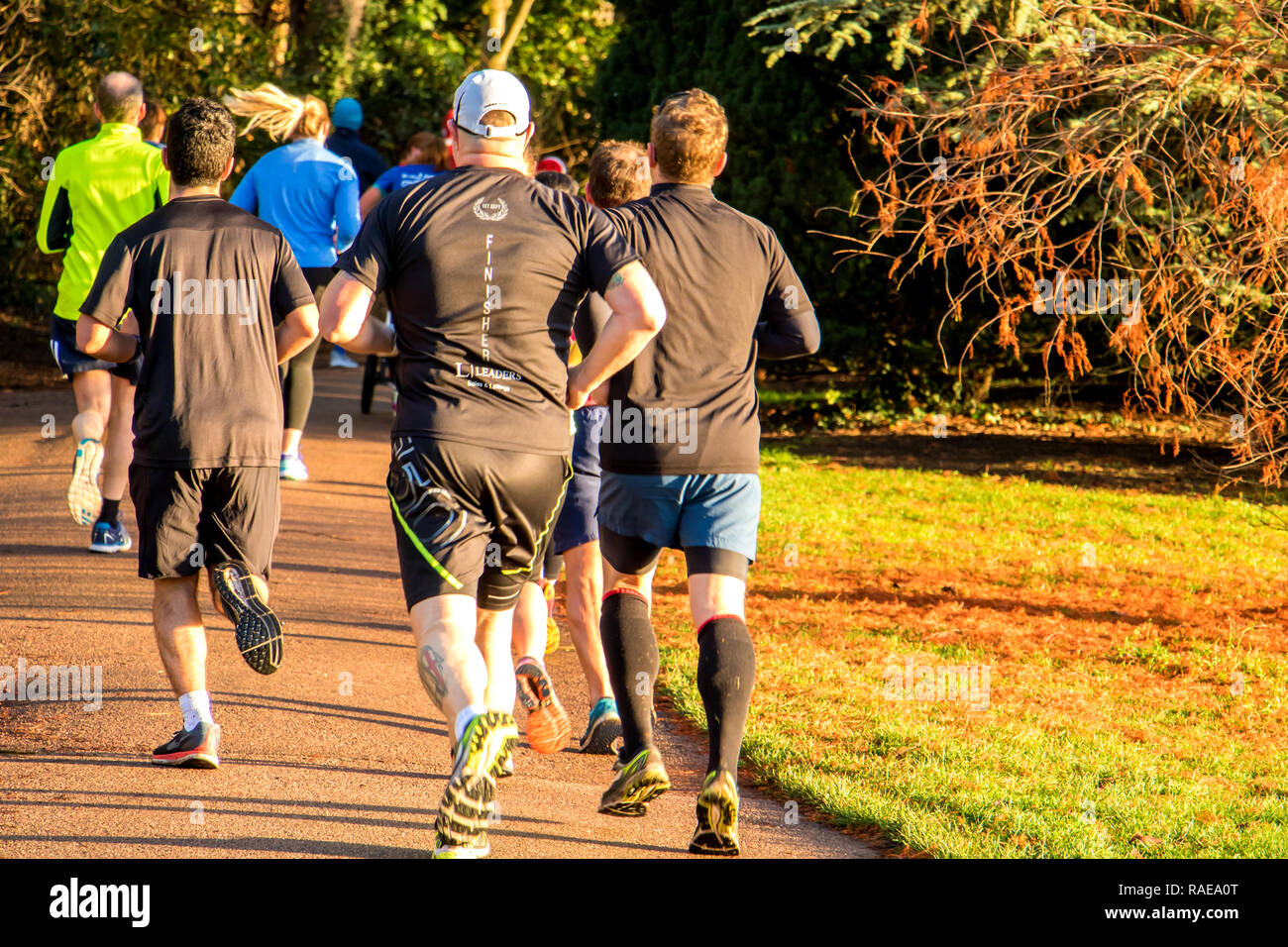 Runners taking part in a parkrun at Bedford Park. This event takes ...