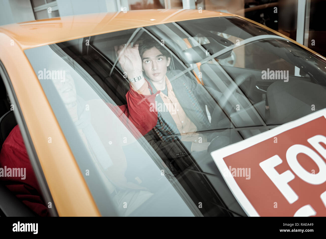Father and son choosing new passenger car for their family Stock Photo ...