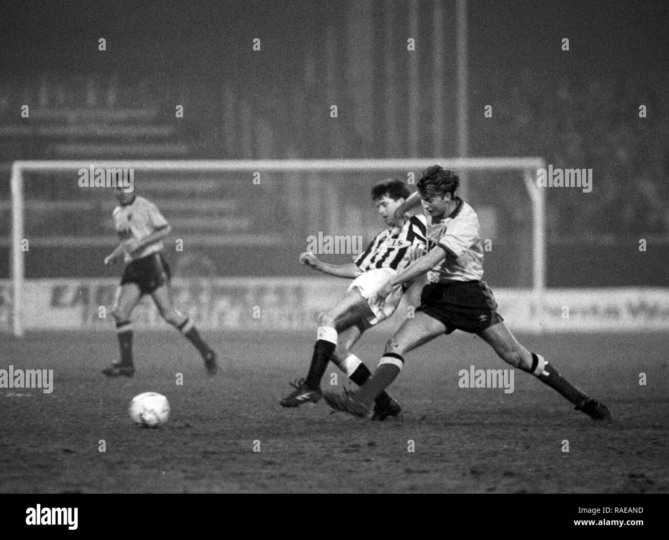 Watford's Tim Sherwood (r) slides in to wrest the ball from Newcastle ...