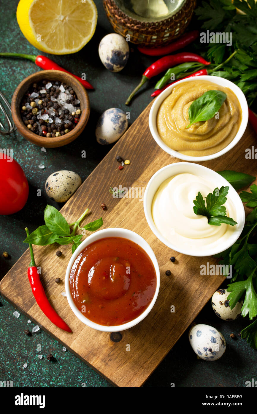 Set of sauces. Homemade Mayonnaise Sauce on the background of stone or ...