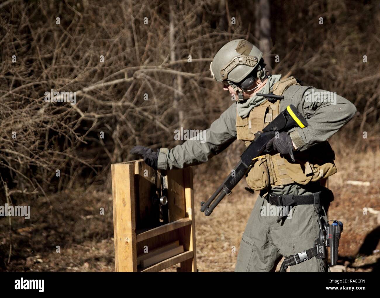 A U.S. Marine attending the Methods of Entry (MOE) course checks the ...
