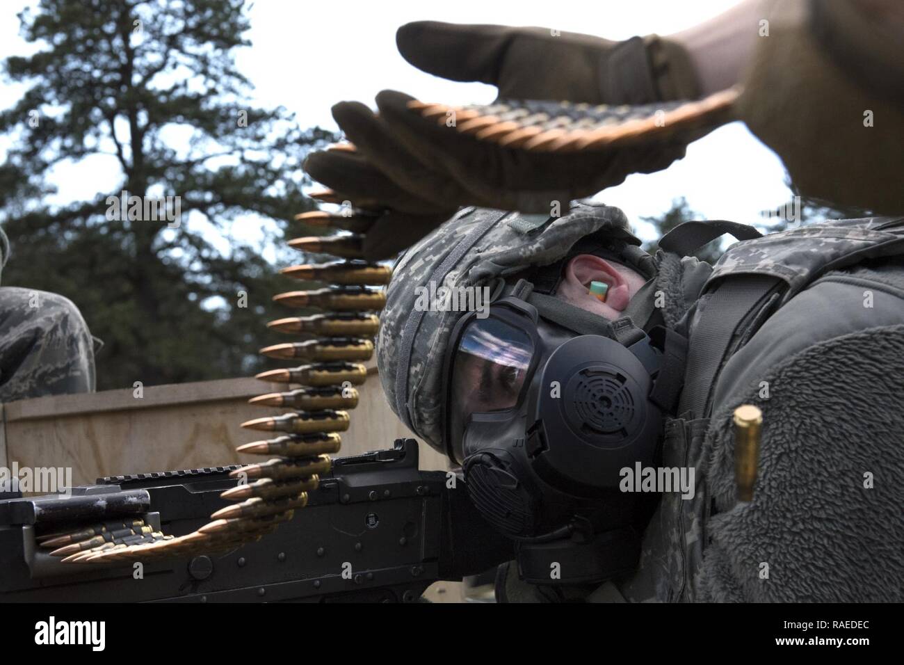 Senior Airman Kyle Hare, 11th Security Forces Squadron member, shoots a ...