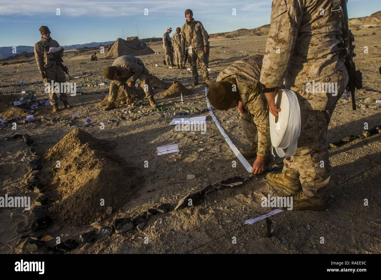 Marines with 1st Marine Regiment, 1st Marine Division, create a terrain ...