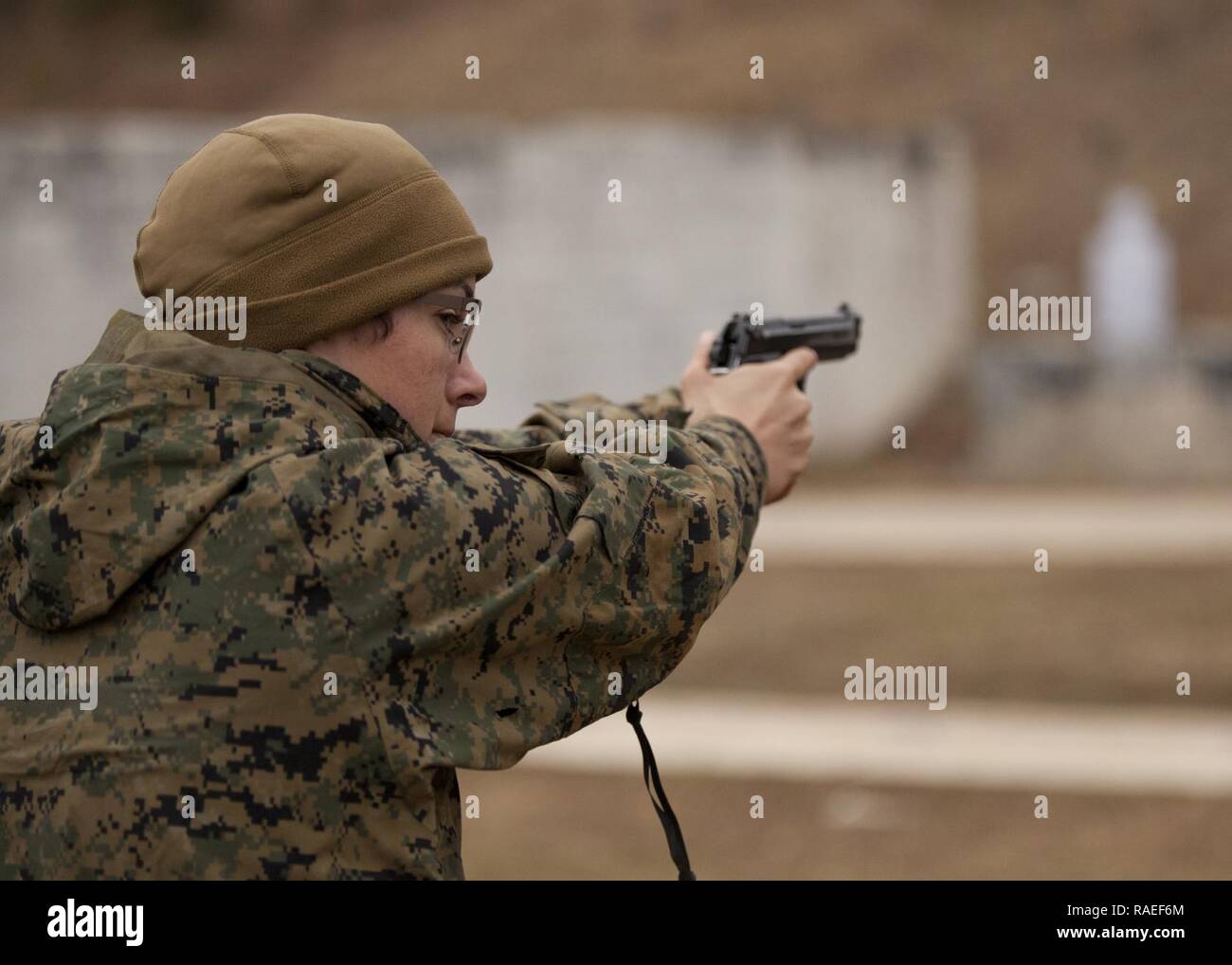 A U.S. Marine assigned to The Basic School conducts the Combat Pistol ...