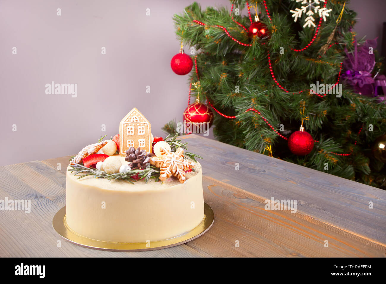Christmas winter cake with hand made decorating house shape cookie on ...