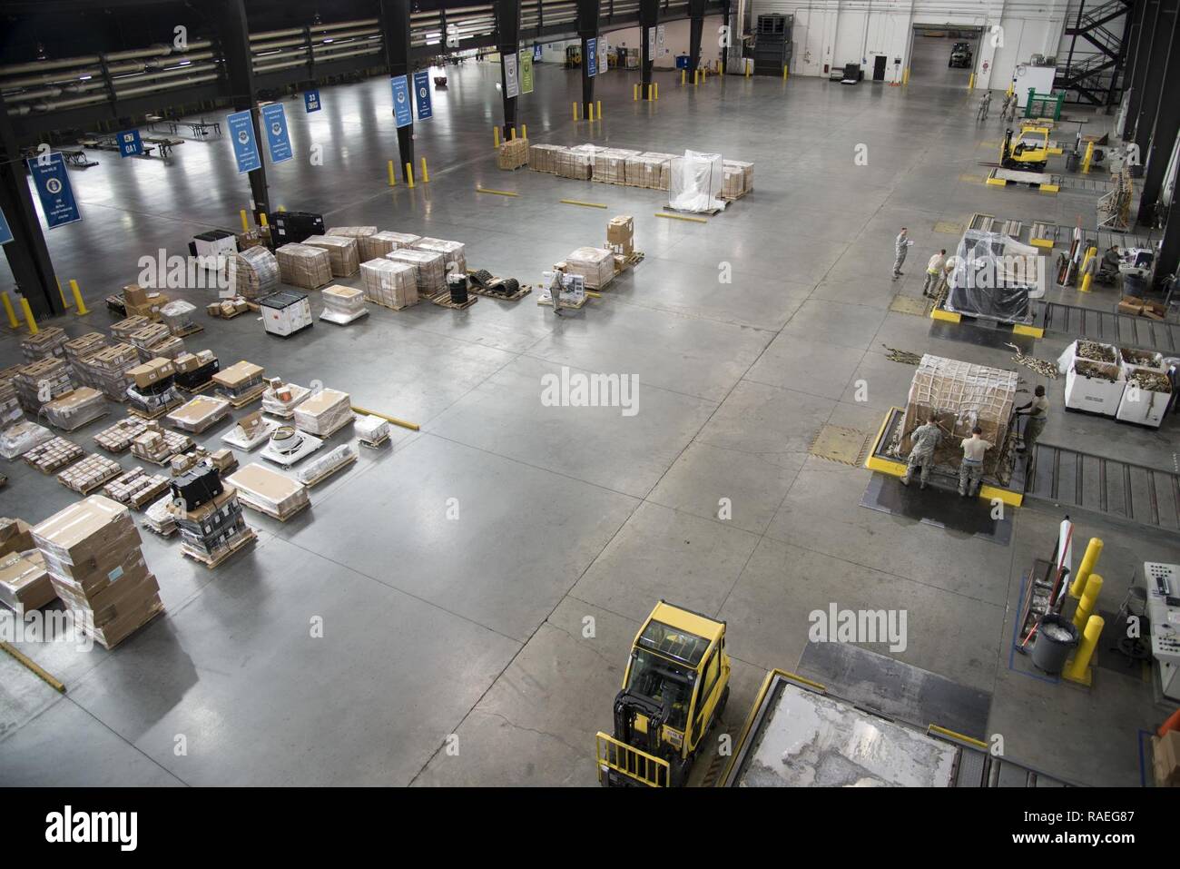 Airmen assigned to the 436th Aerial Port Squadron build pallets Jan. 12 ...